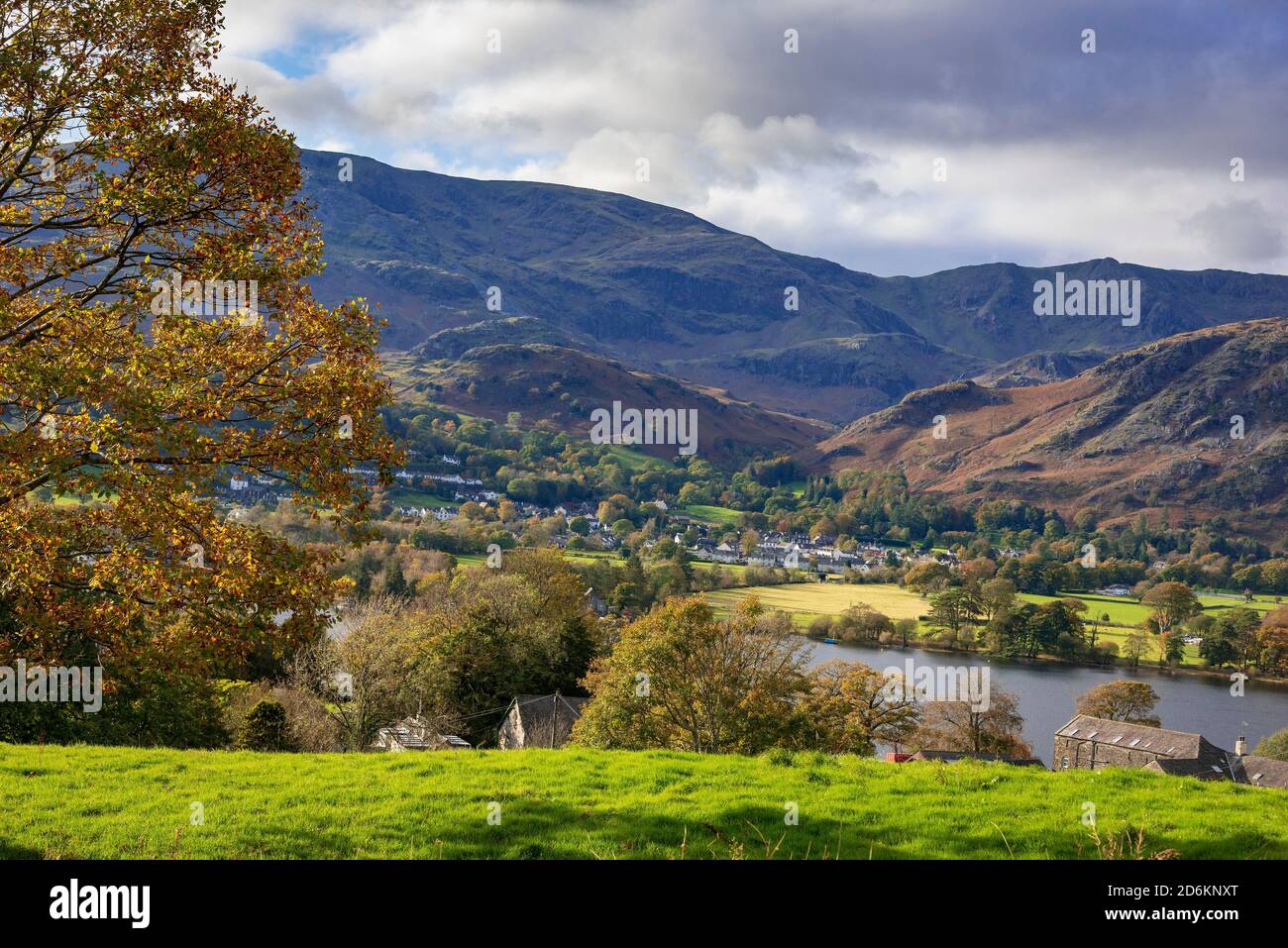 The Old Man of Coniston fell seen above the village and Coniston Water ...