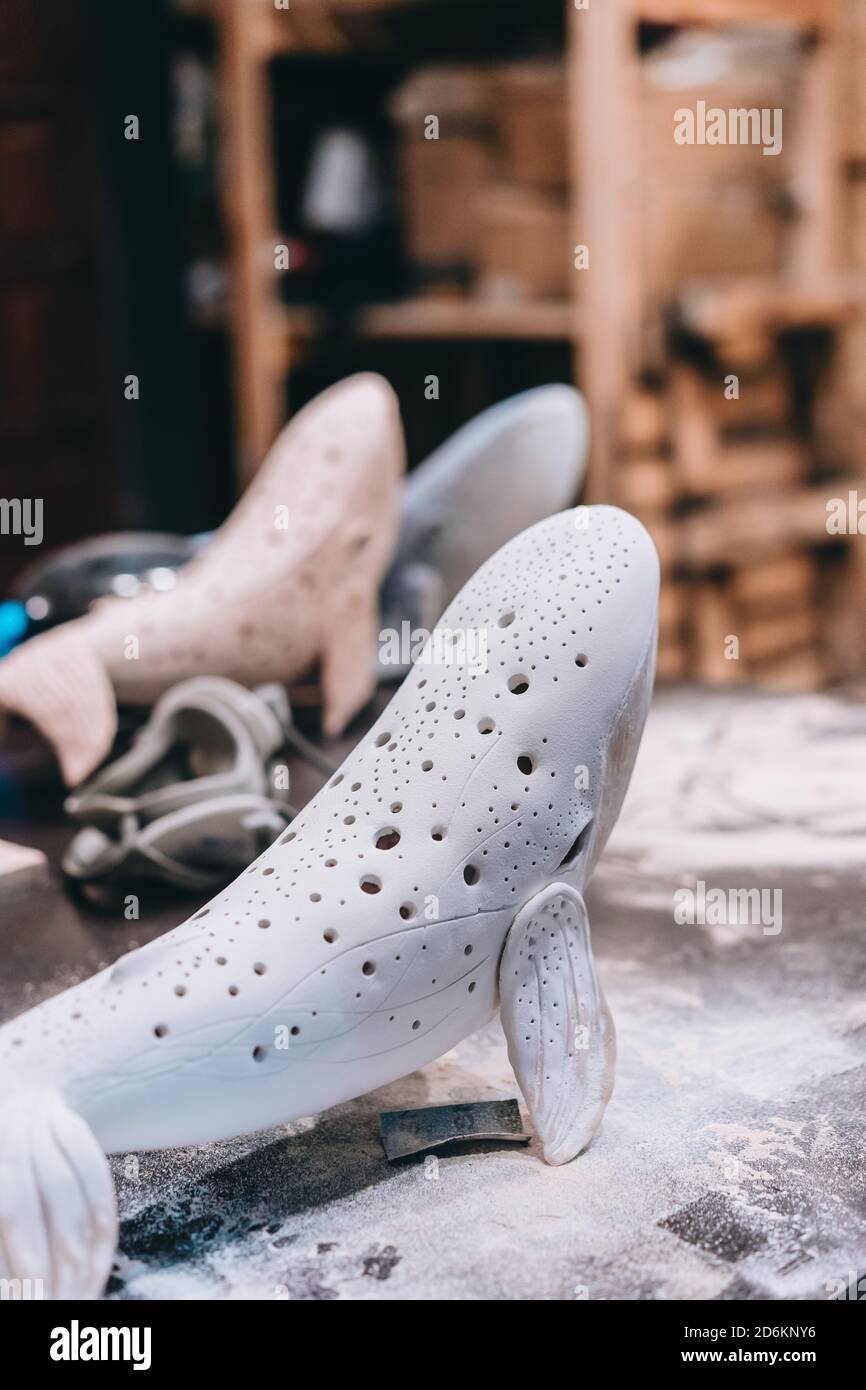 Finished pottery stands on a shelf in a pottery workshop Stock Photo ...