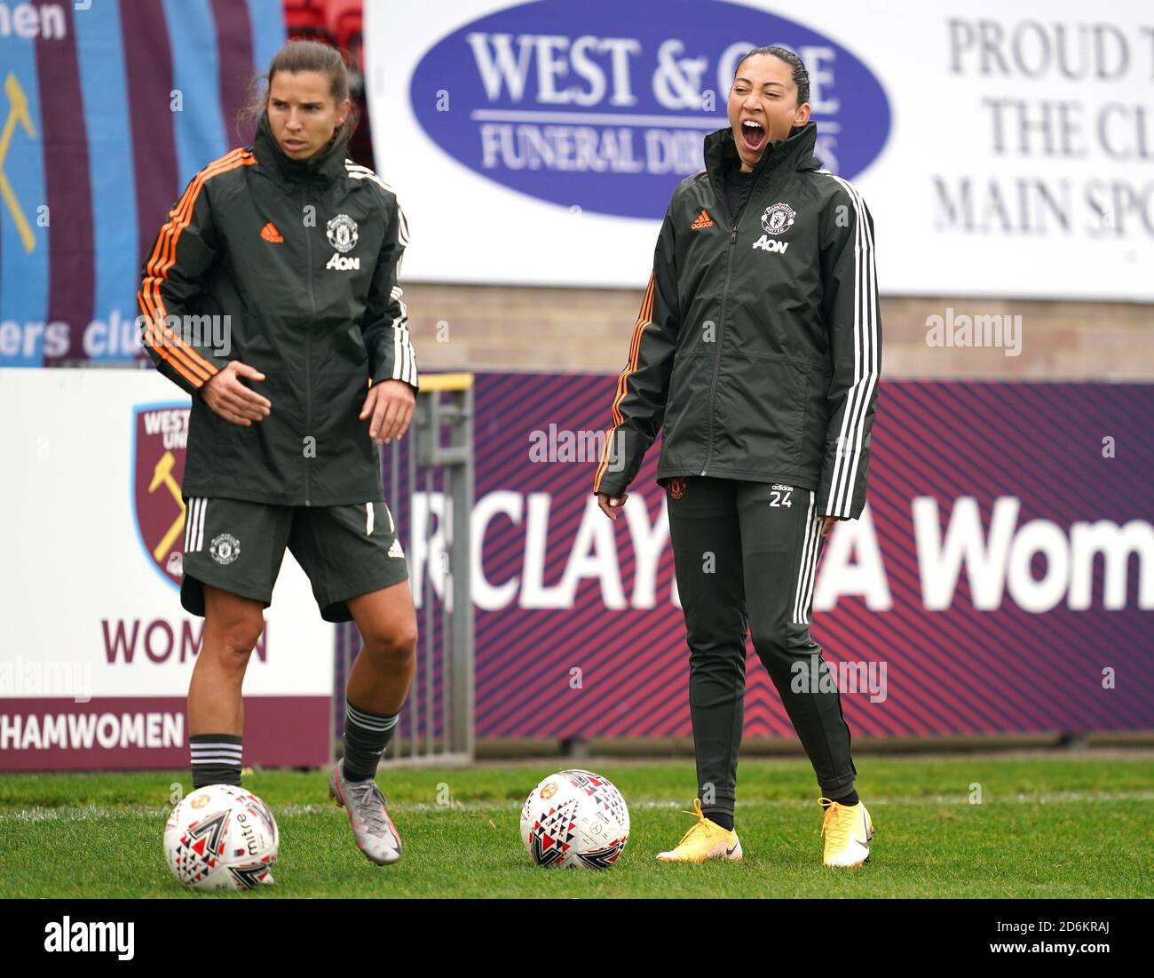 Manchester United's Tobin Heath (left) and Christen Press warm up prior ...