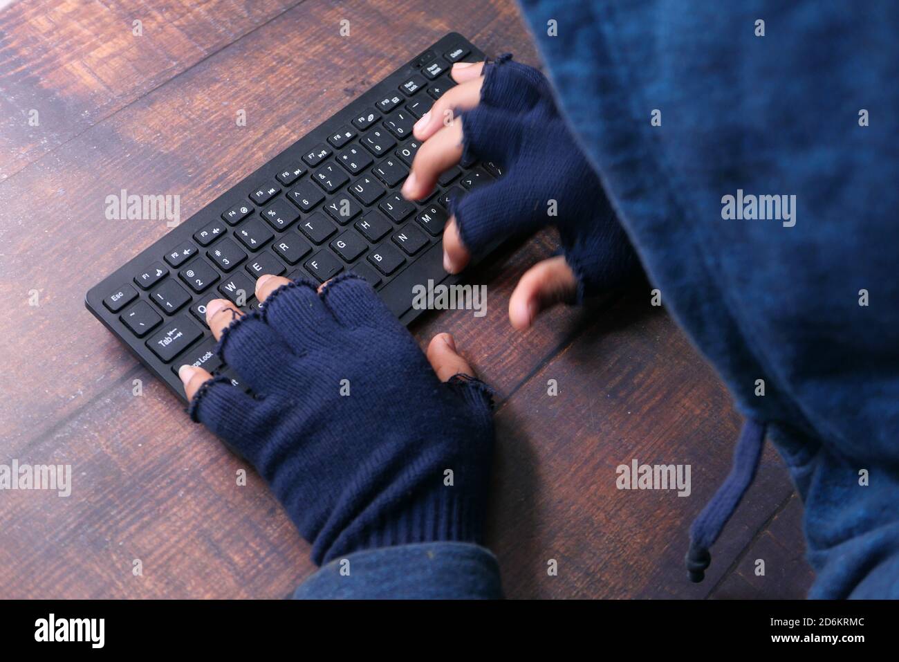 hacker hand stealing data from laptop top down Stock Photo - Alamy