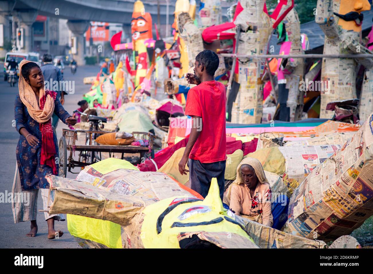 economically poor old man and woman in unkempt clothes pasting colorful ...