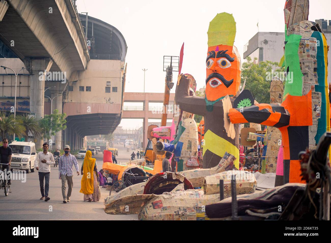 Low shot of old poor unkempt lady working on the side of a busy street ...