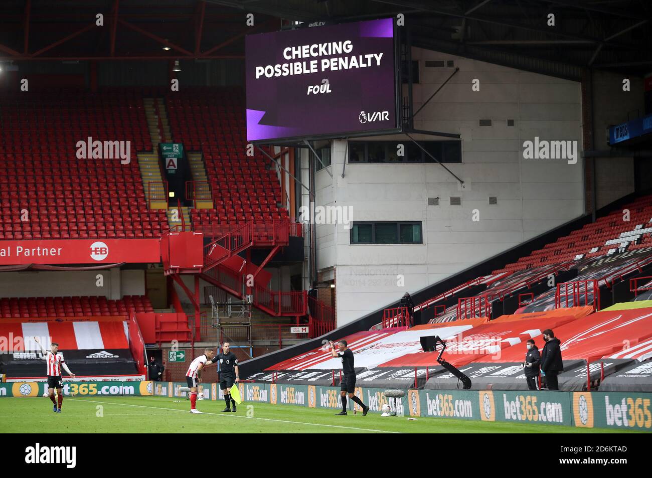 Referee Andre Marriner checks the VAR pitch side monitor during the ...
