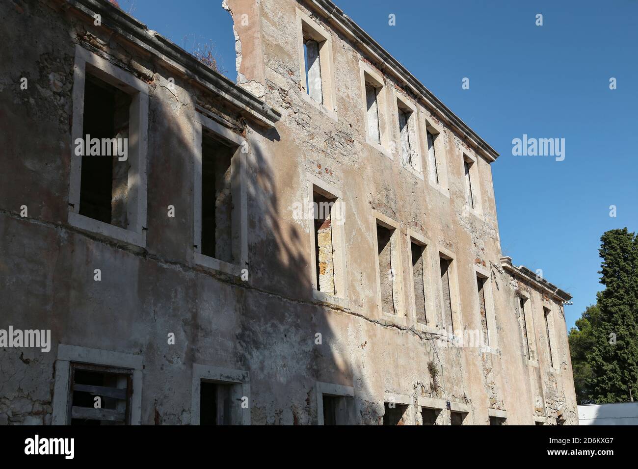Low angle shot of a fragment of the wall of a destroyed house during ...