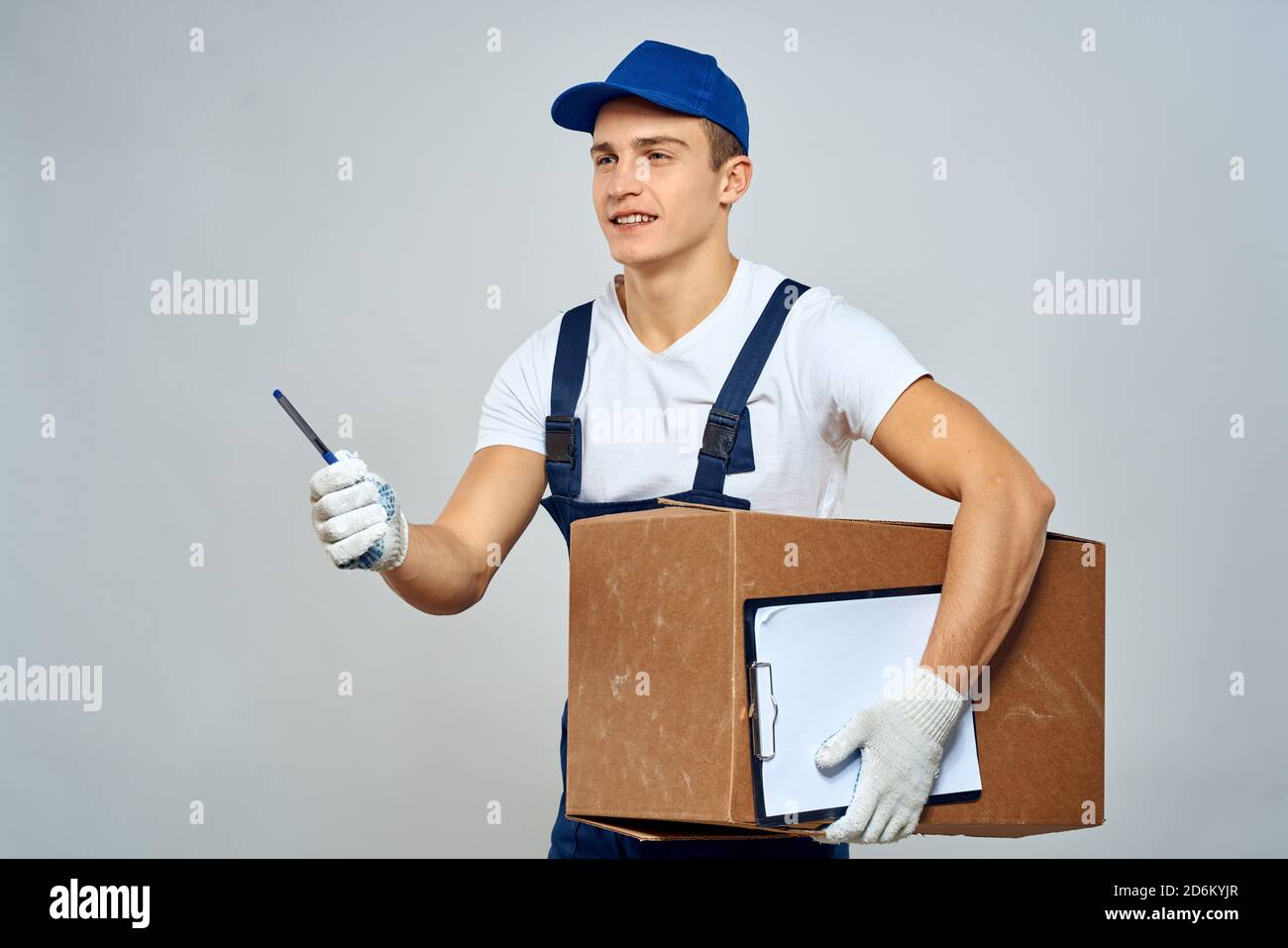 Man worker with box in hands delivery loading service packing service ...