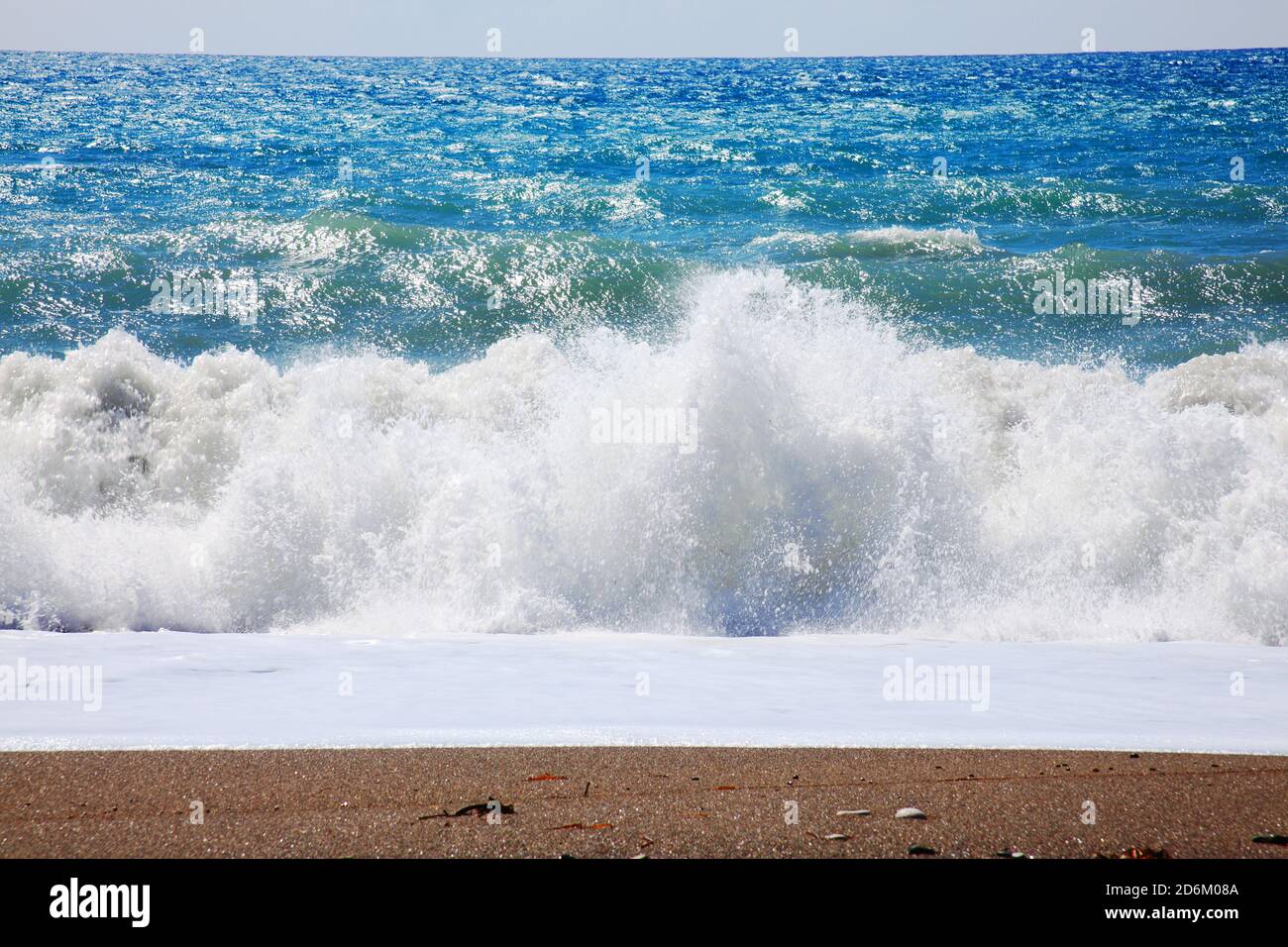 The Mediterranean Sea with large waves and surf, seen from a shoreline ...