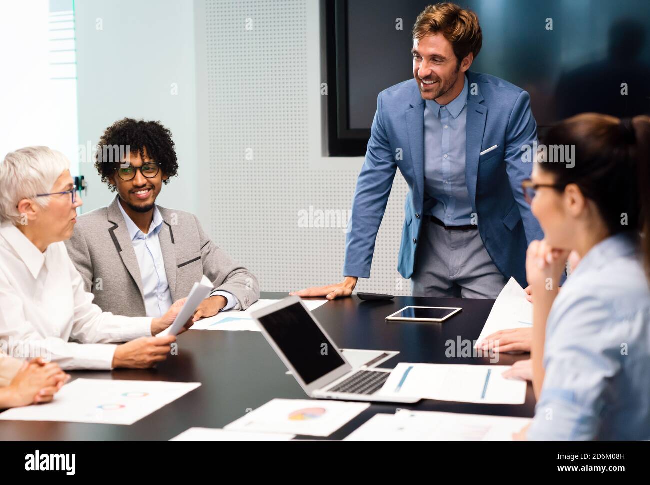 Portrait of successful business team working in office Stock Photo - Alamy