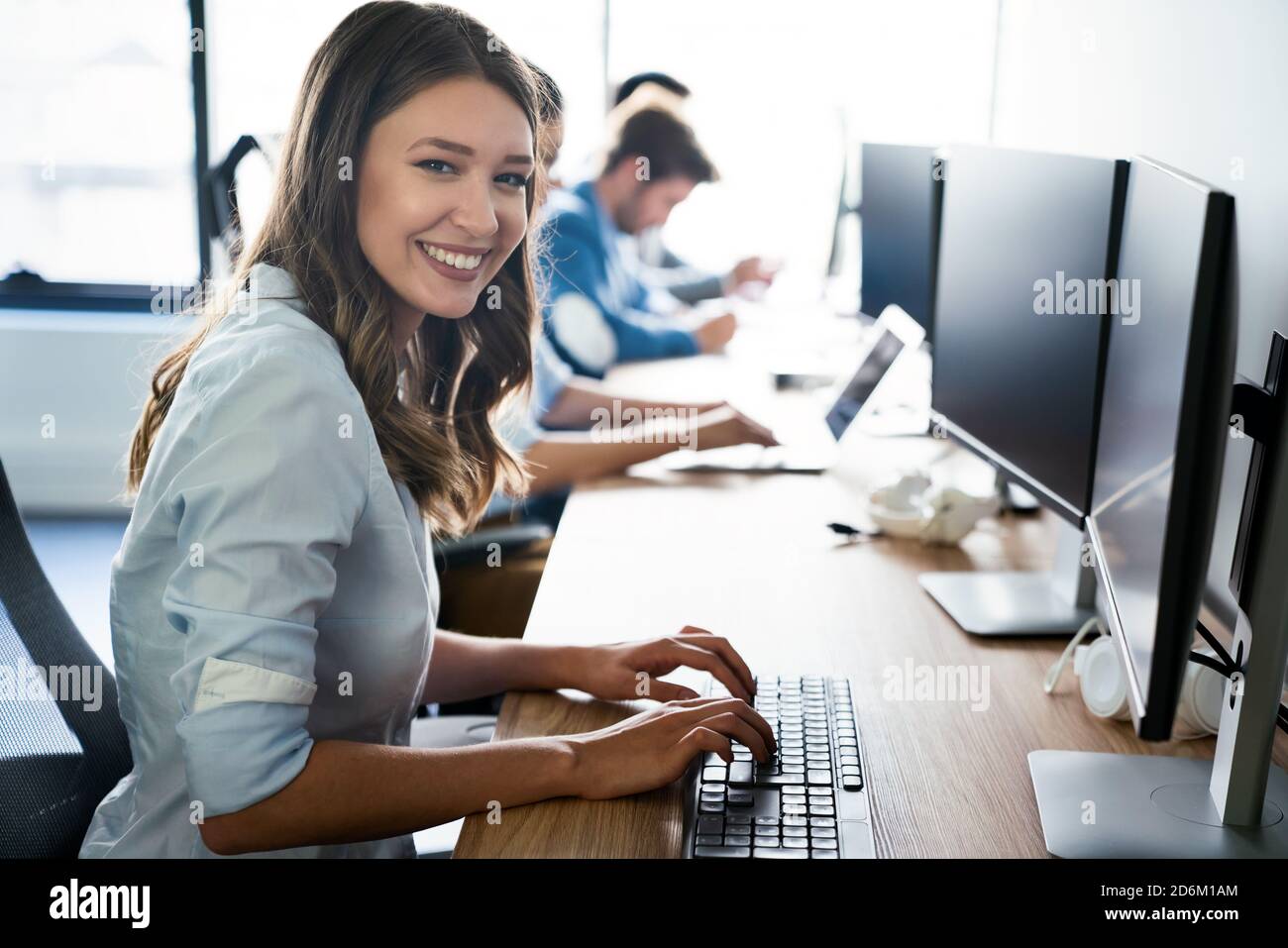 Programmers cooperating brainstorming at information technology company Stock Photo - Alamy
