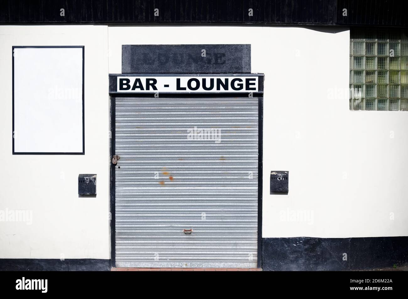 Bar lounge with blank signs and closed shutter door Stock Photo - Alamy