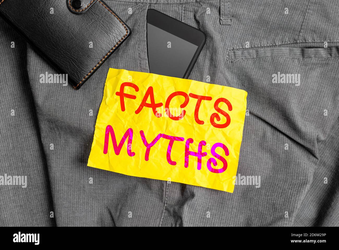 Writing note showing Facts Myths. Business concept for work based on ...