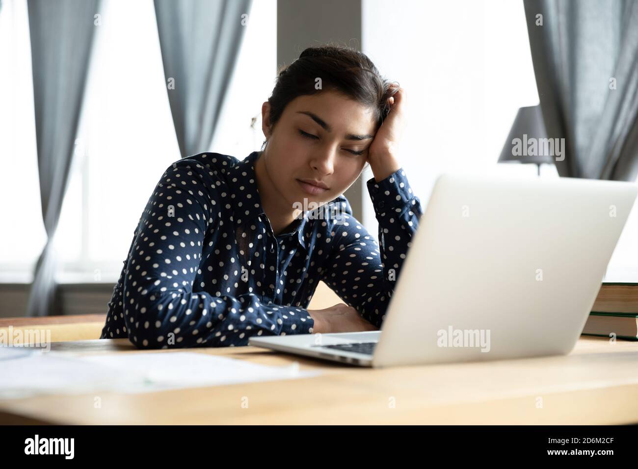 Bored sleepy indian businesswoman fall asleep seated at workplace desk ...