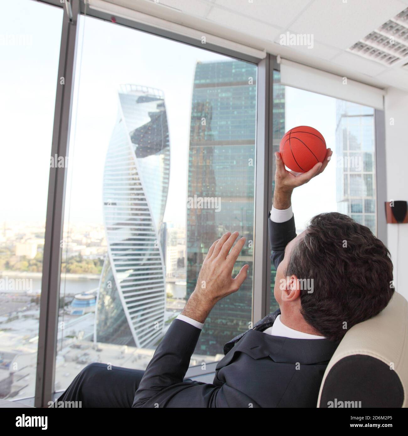 Business man playing with a basketball at the office Stock Photo - Alamy