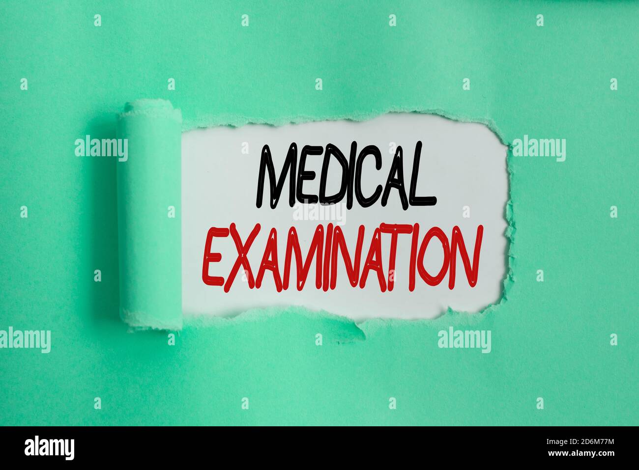 Writing note showing Medical Examination. Business concept for the ...