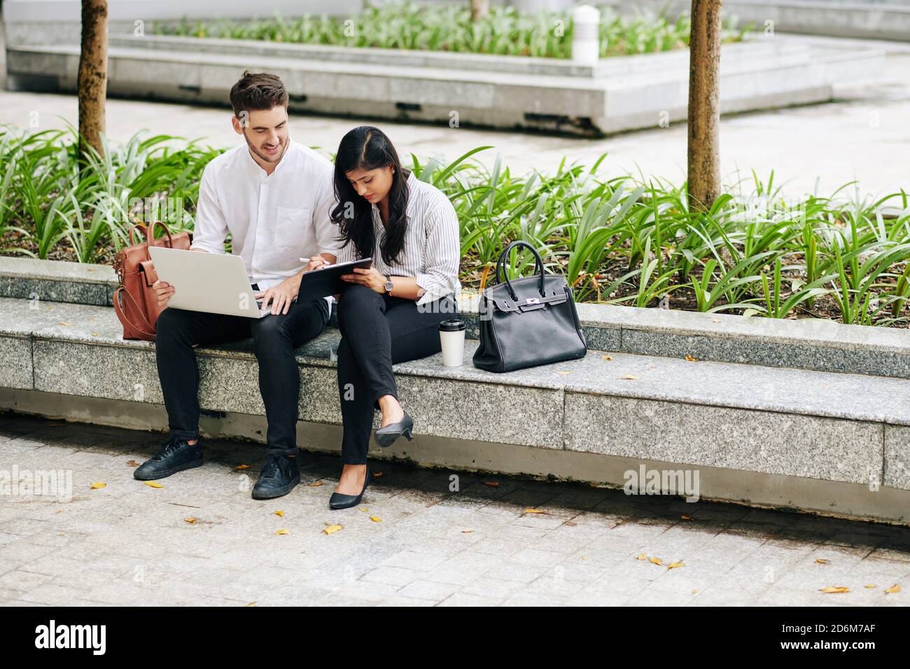 Business couple analyzing data Stock Photo - Alamy