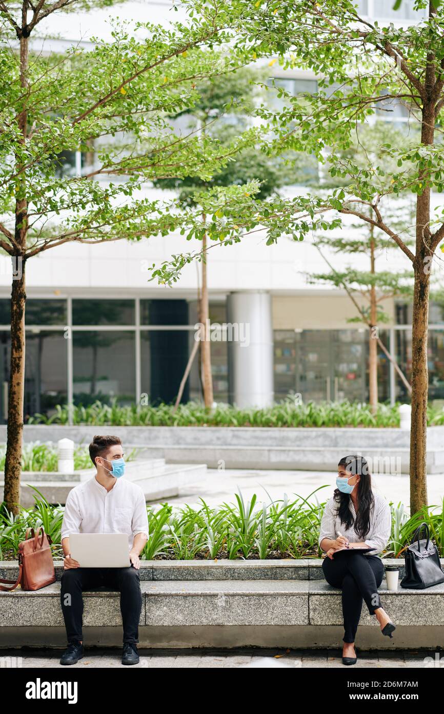 Smiling indian freelancer working outdoors hi-res stock photography and images - Alamy