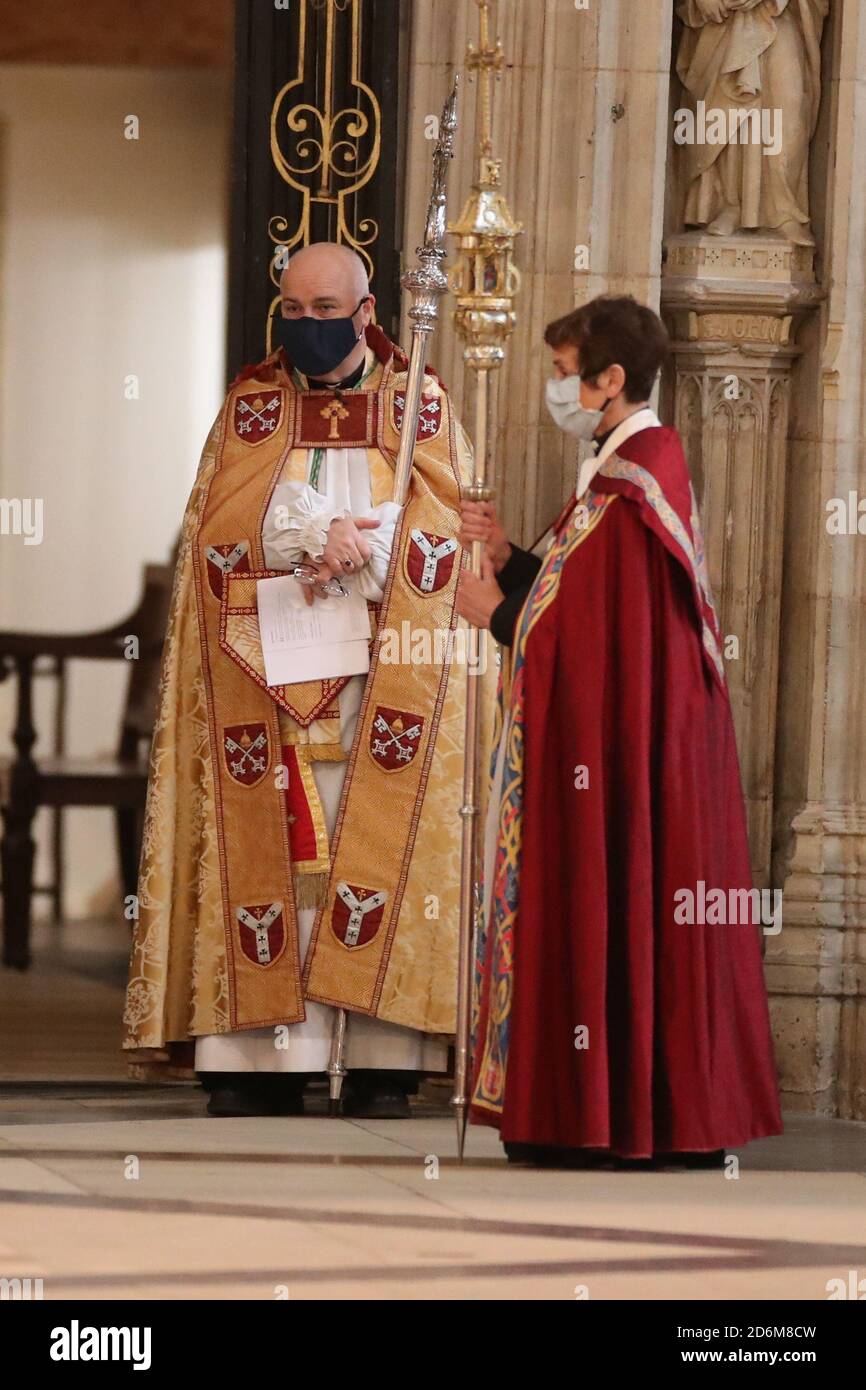 The Most Reverend Stephen Cottrell (left), wearing a face covering ...