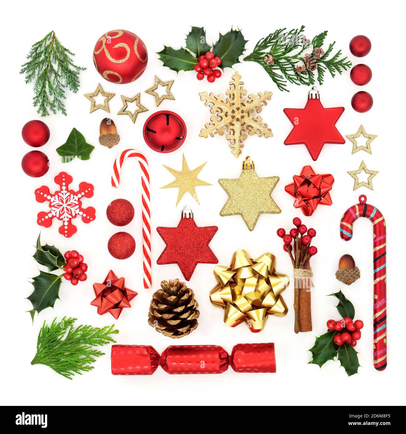 Traditional symbols of Christmas with bauble decorations & winter flora ...