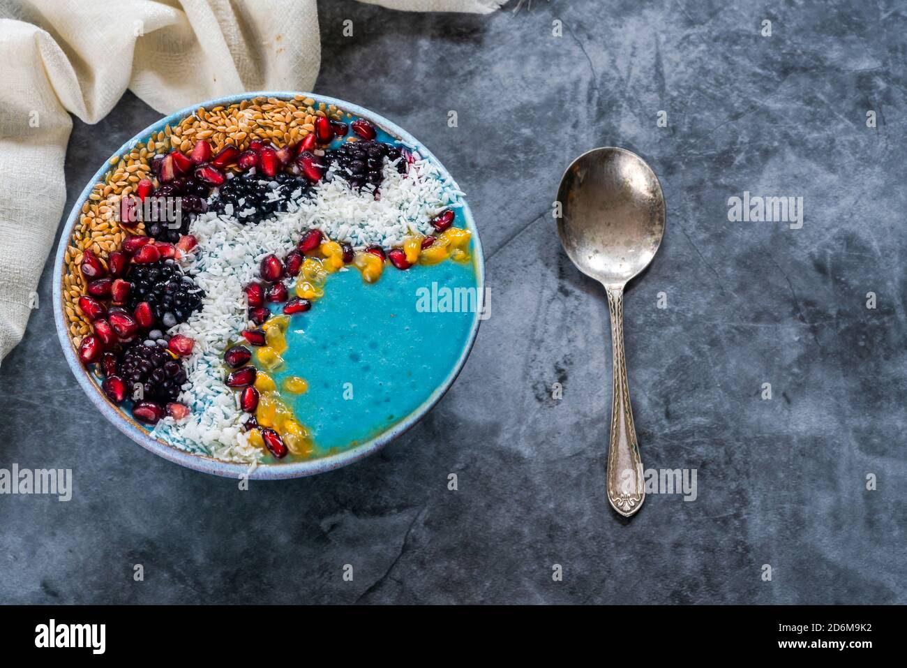 Blue spirulina smoothie bowl with fruit and linseed - healthy superfood ...