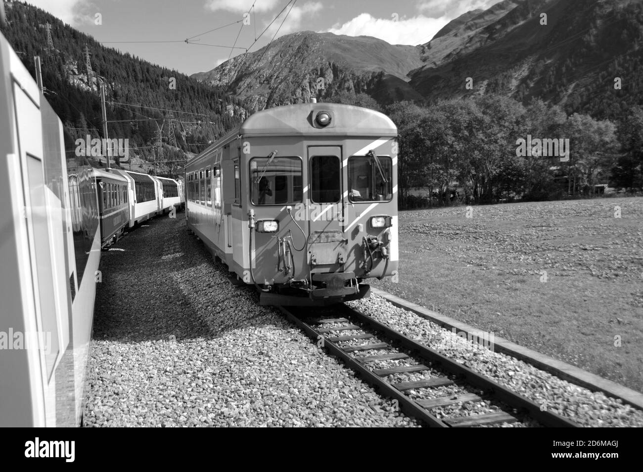 The glacier Express train is driving across the swiss alps and through ...