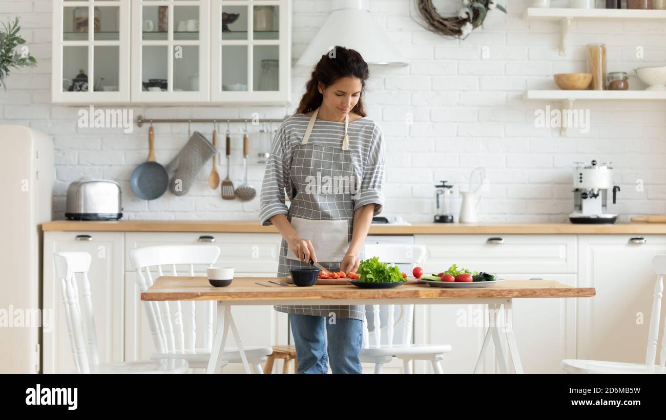 Woman wearing apron in kitchen hi-res stock photography and images - Alamy