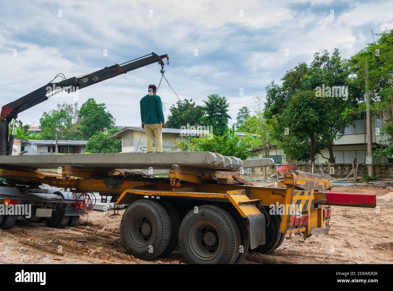 pile concrete pillars on trailer truck in construction site Stock Photo ...
