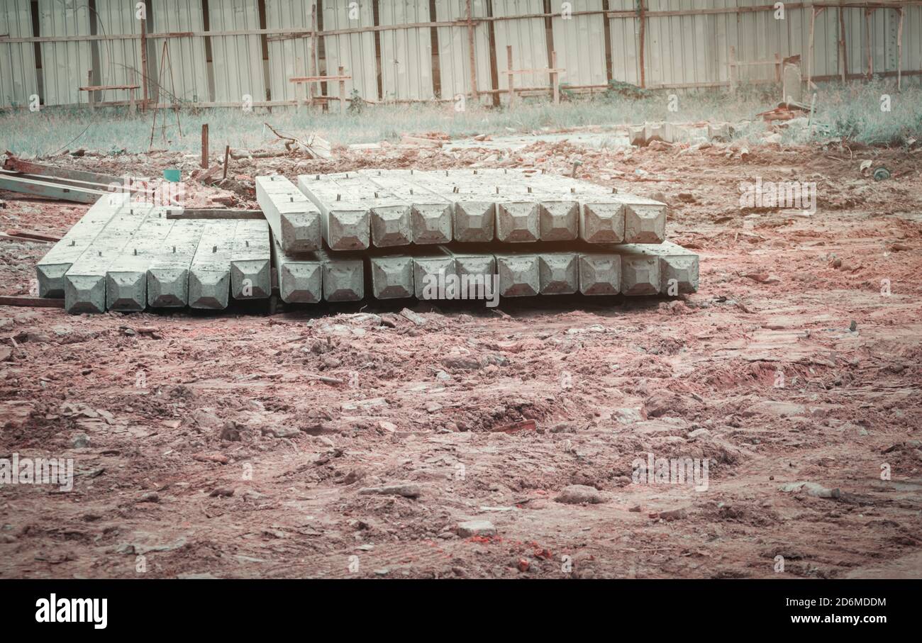 pile concrete pillars on ground in construction site Stock Photo - Alamy