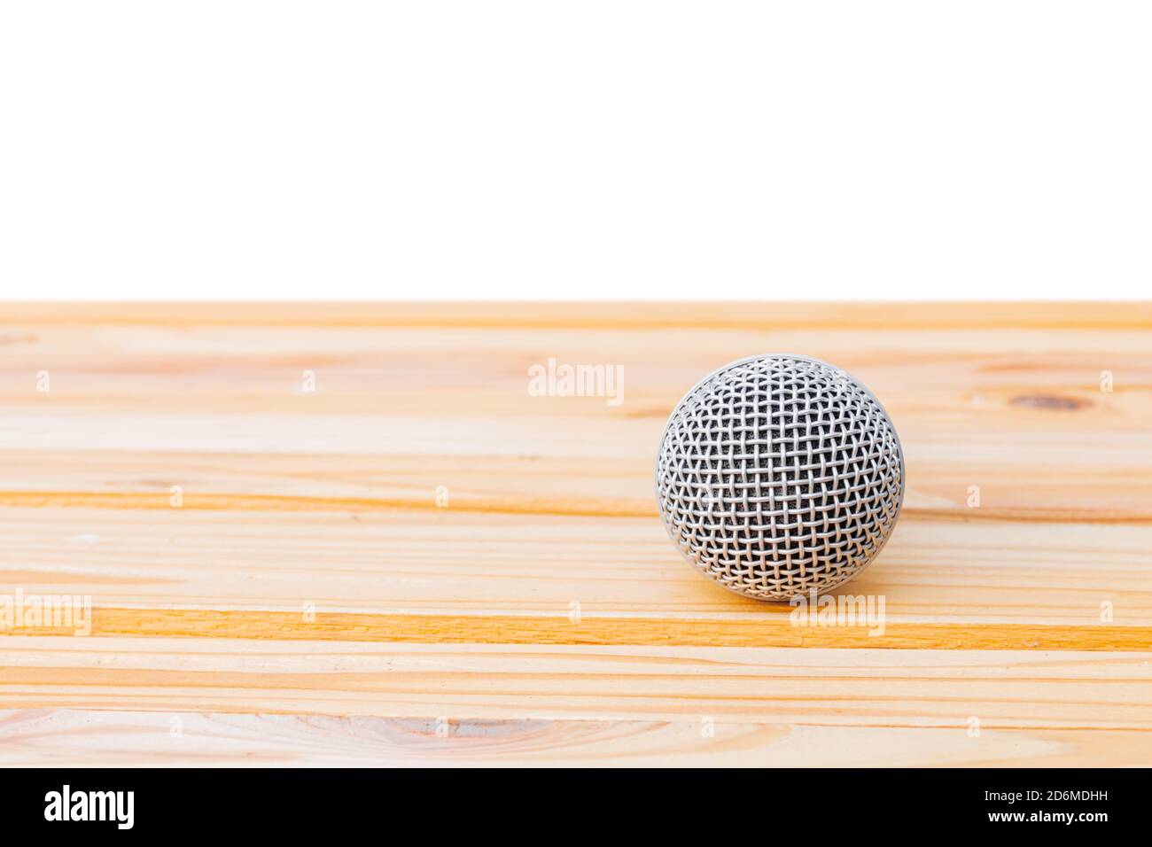 microphone dynamic on wooden table yellow with white background Stock ...