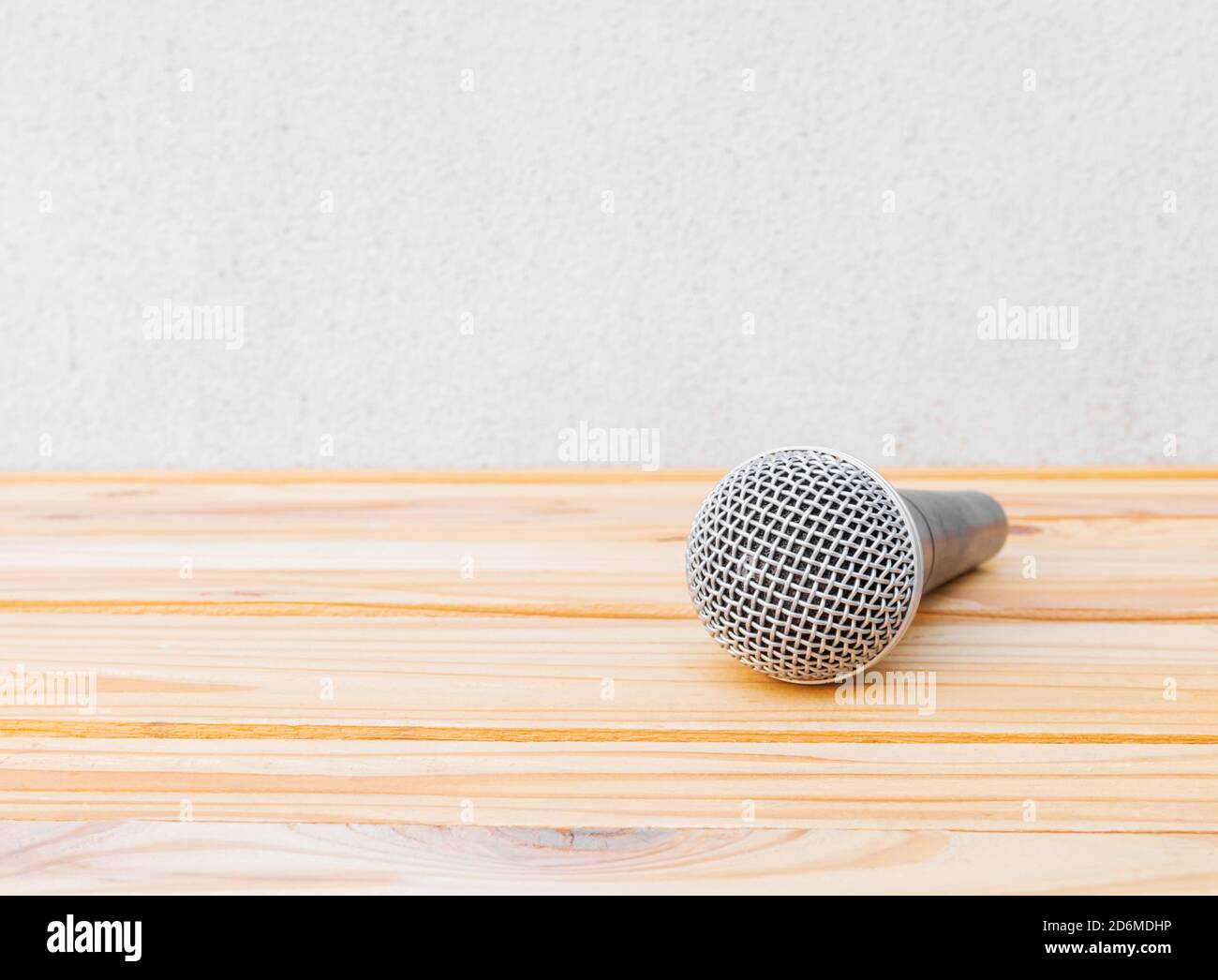 microphone dynamic on wooden table yellow with white background Stock ...