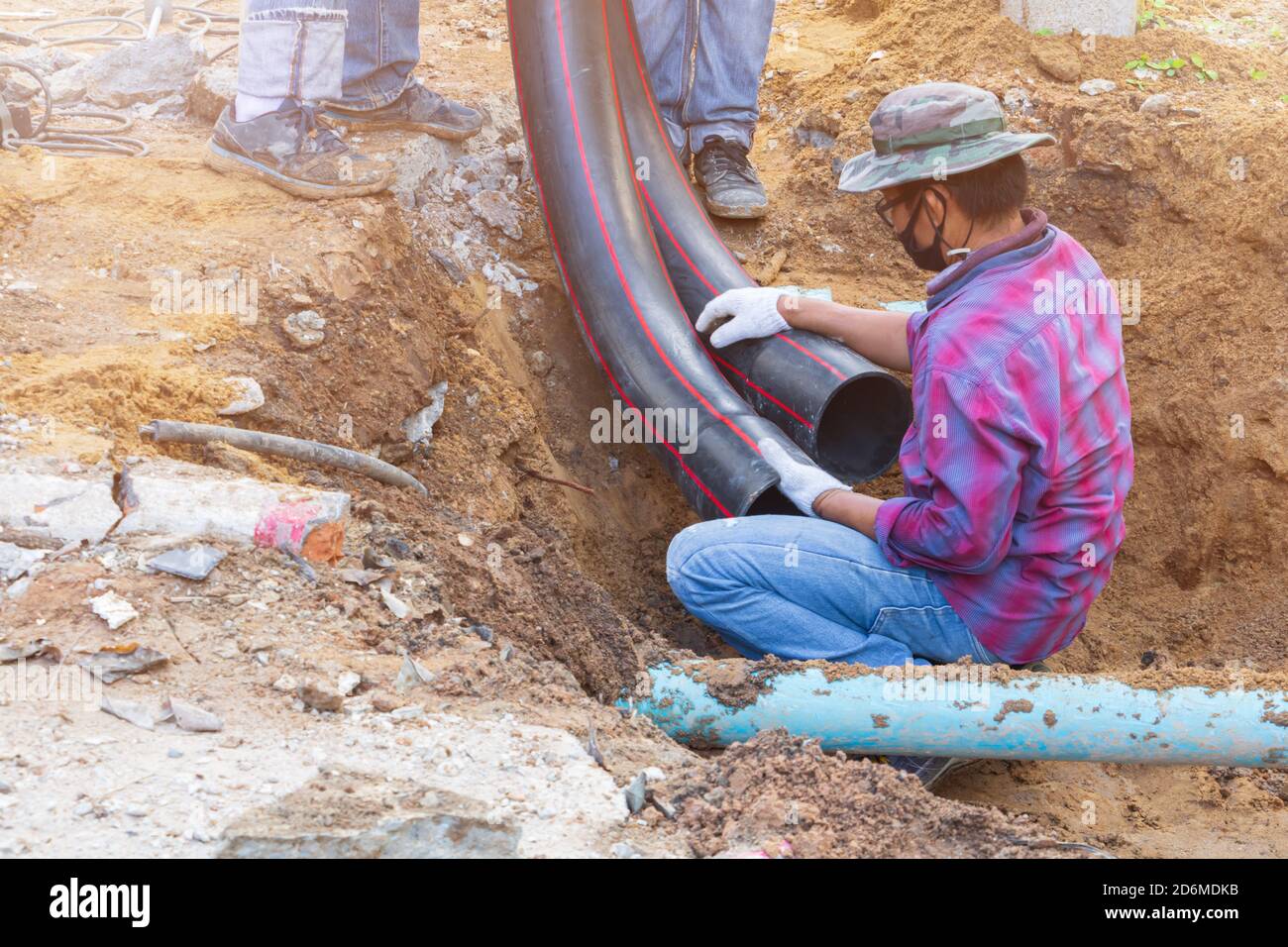 repair water pipes black and worker On the ground Stock Photo - Alamy