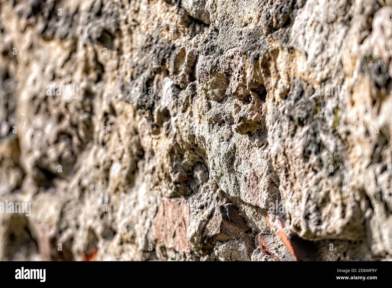 decorative exterior wall plaster with embossed surface, selective focus ...