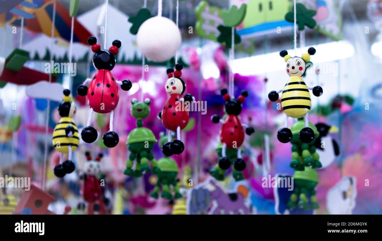 wooden toys hanging in a store Stock Photo - Alamy