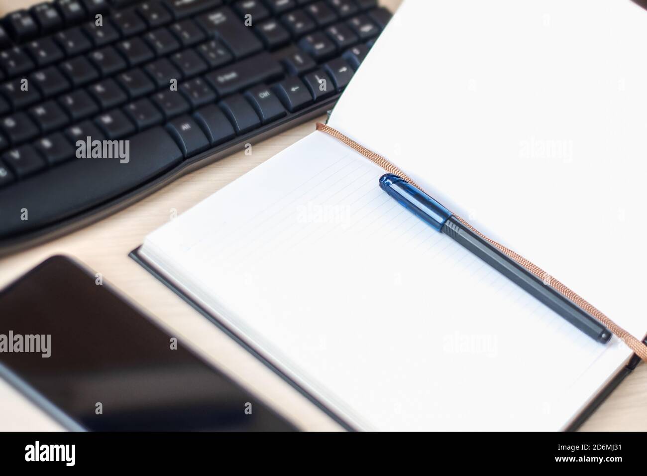 Workplace with pc, phone and notebook for notes Stock Photo - Alamy