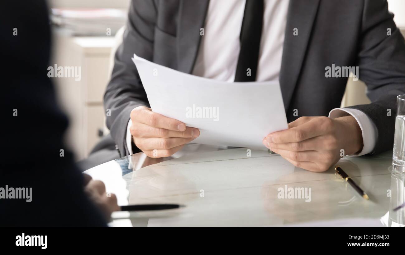 Employer holding paper CV resume, interviewing job candidate Stock ...