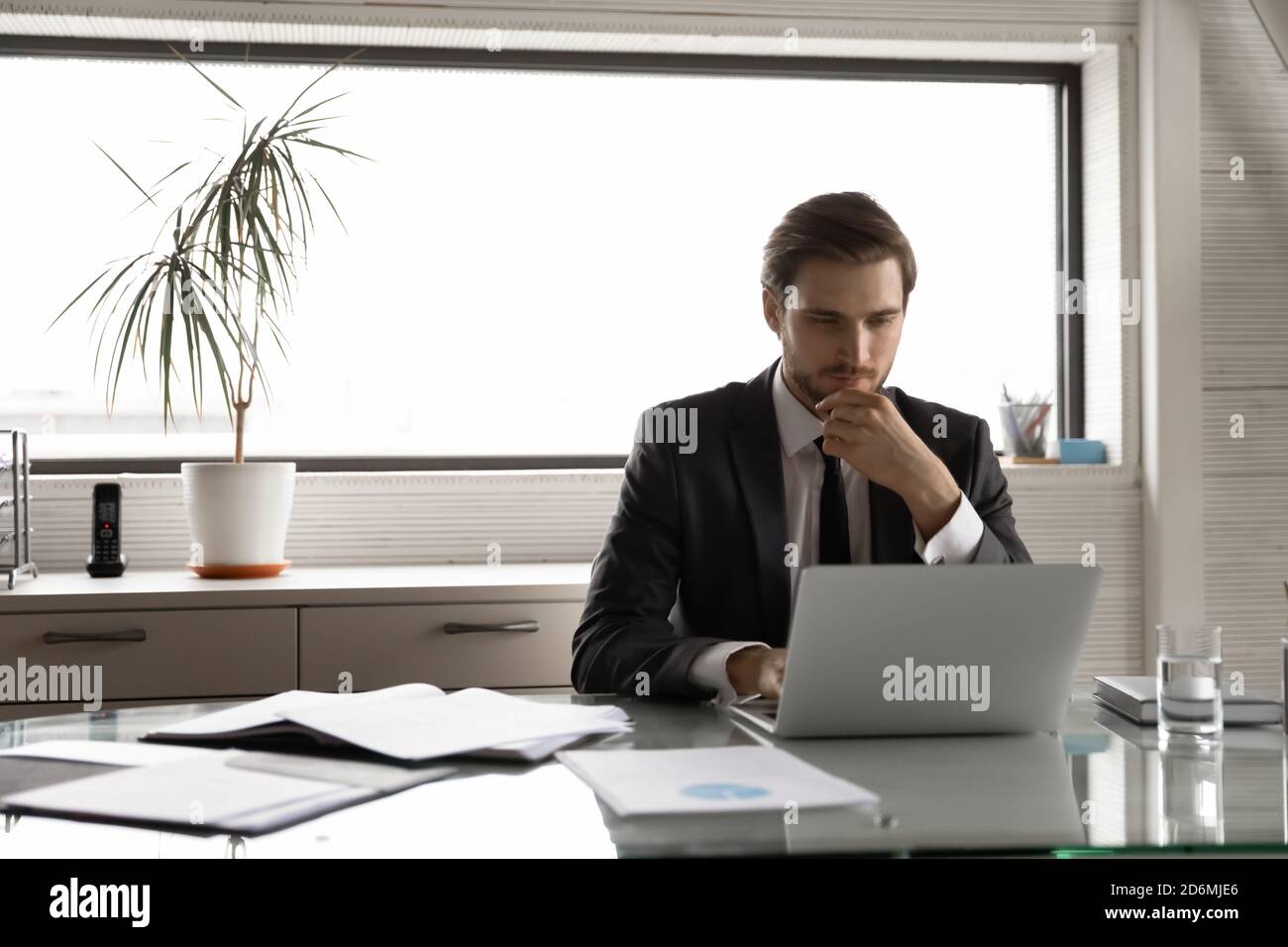 Focused young ceo manager leader working on computer Stock Photo - Alamy