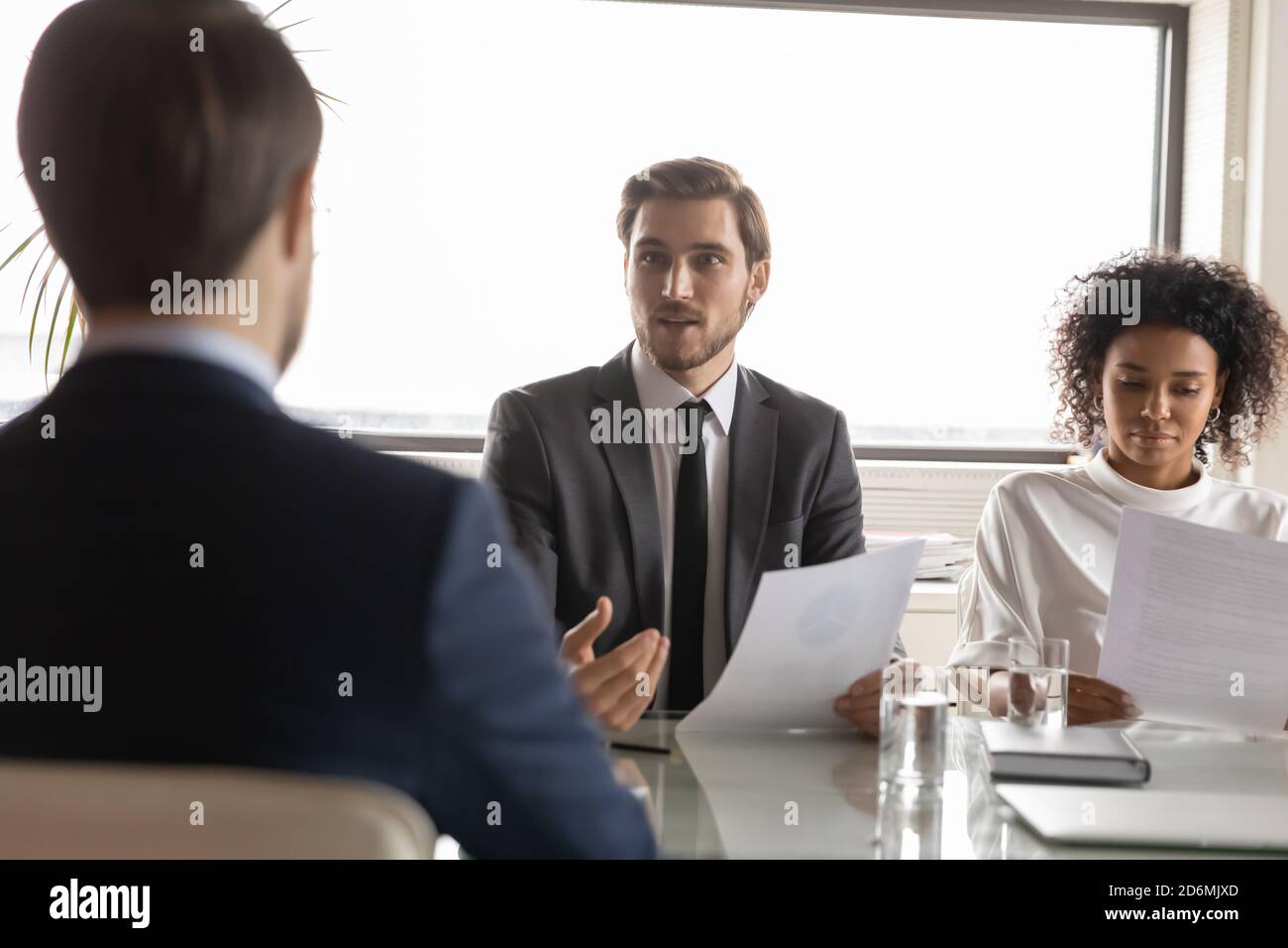 Diverse employees listening colleague hi-res stock photography and ...
