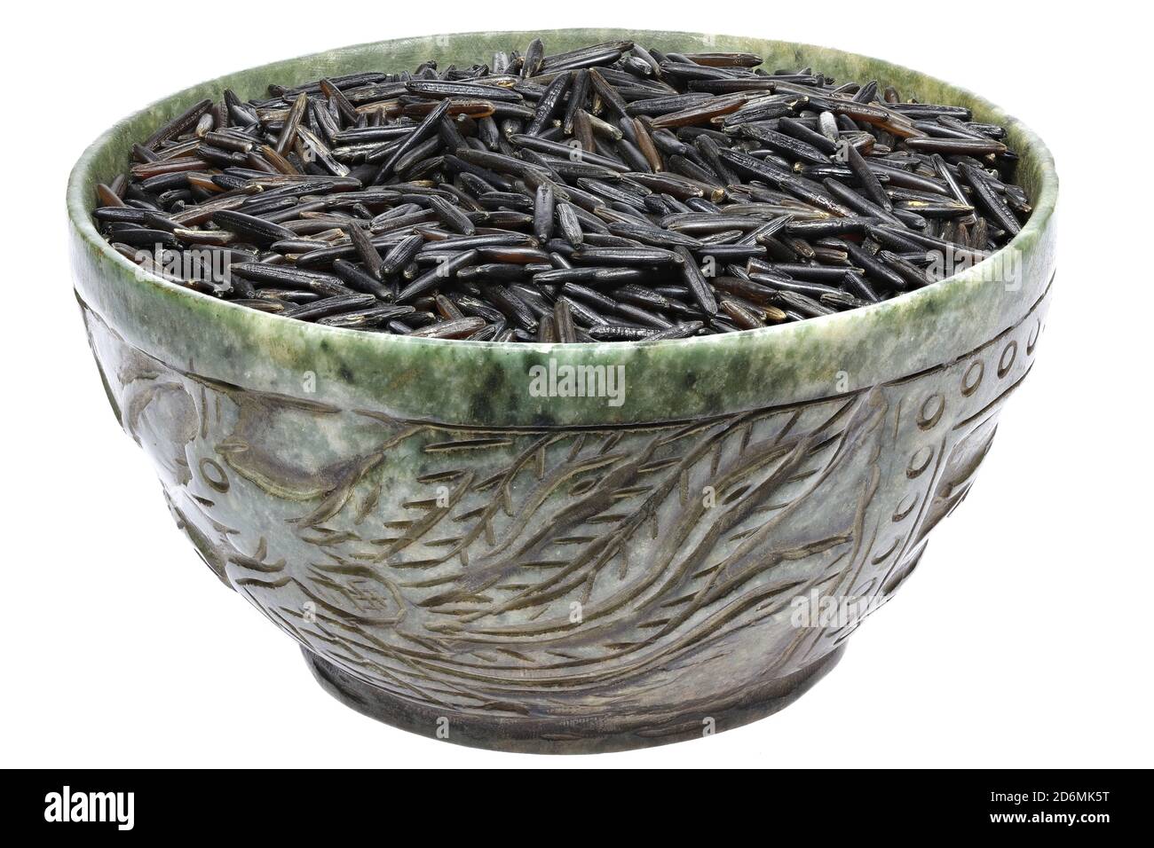wild rice in a vintage jade bowl isolated on white background Stock ...
