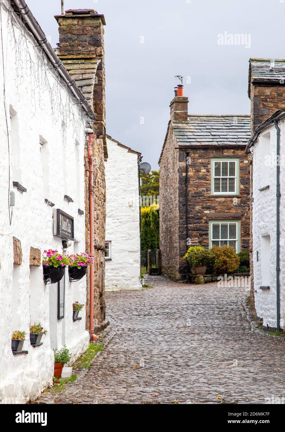 The narrow cobbled streets of the Cumbrian village of Dent in Dentdale ...