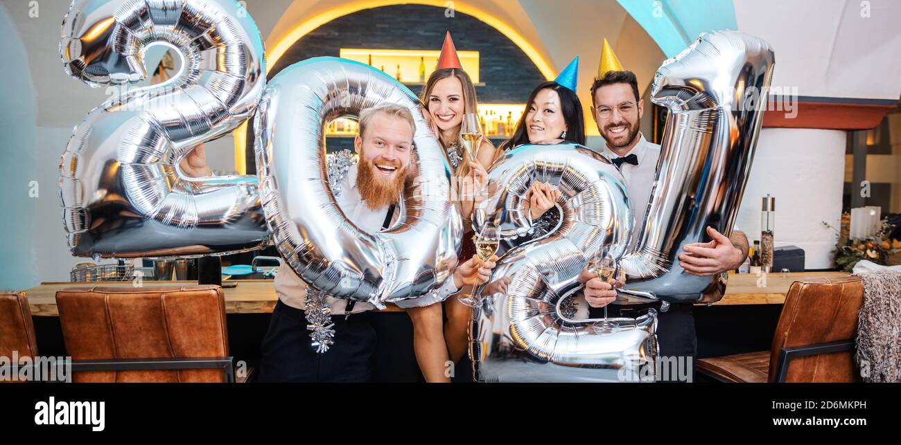Group of party people celebrating the arrival of 2021 Stock Photo - Alamy