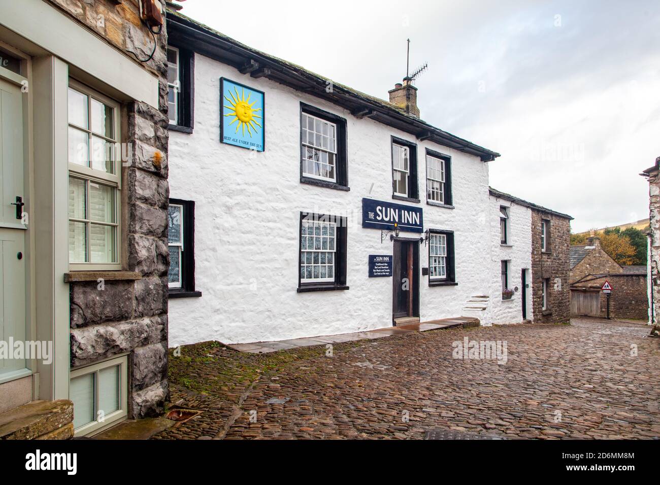 The Sun Inn in on the cobbled streets of the Cumbrian village of Dent ...