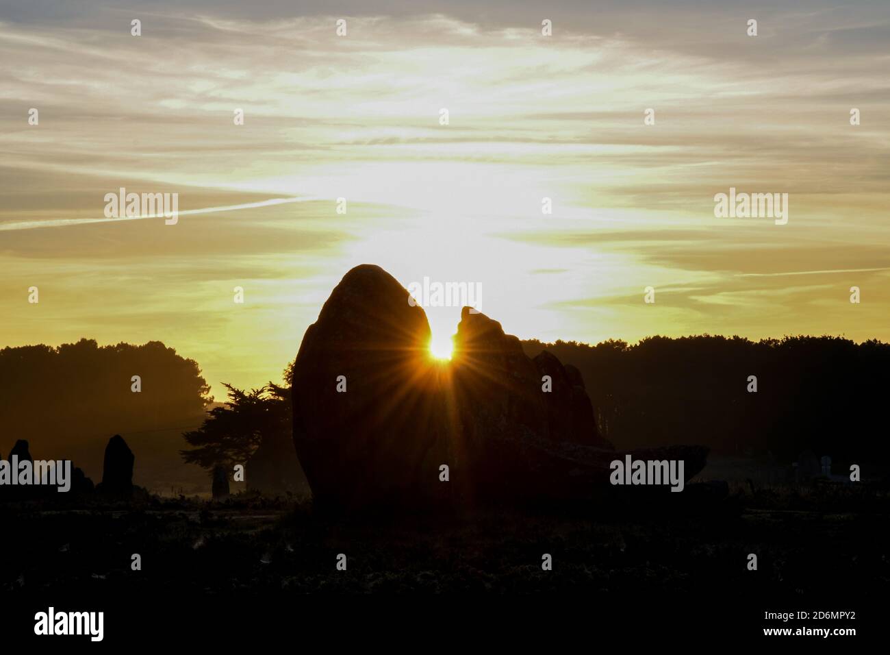 Sunrise over one of the great Standing Stones at Carnac, Brittany Stock ...