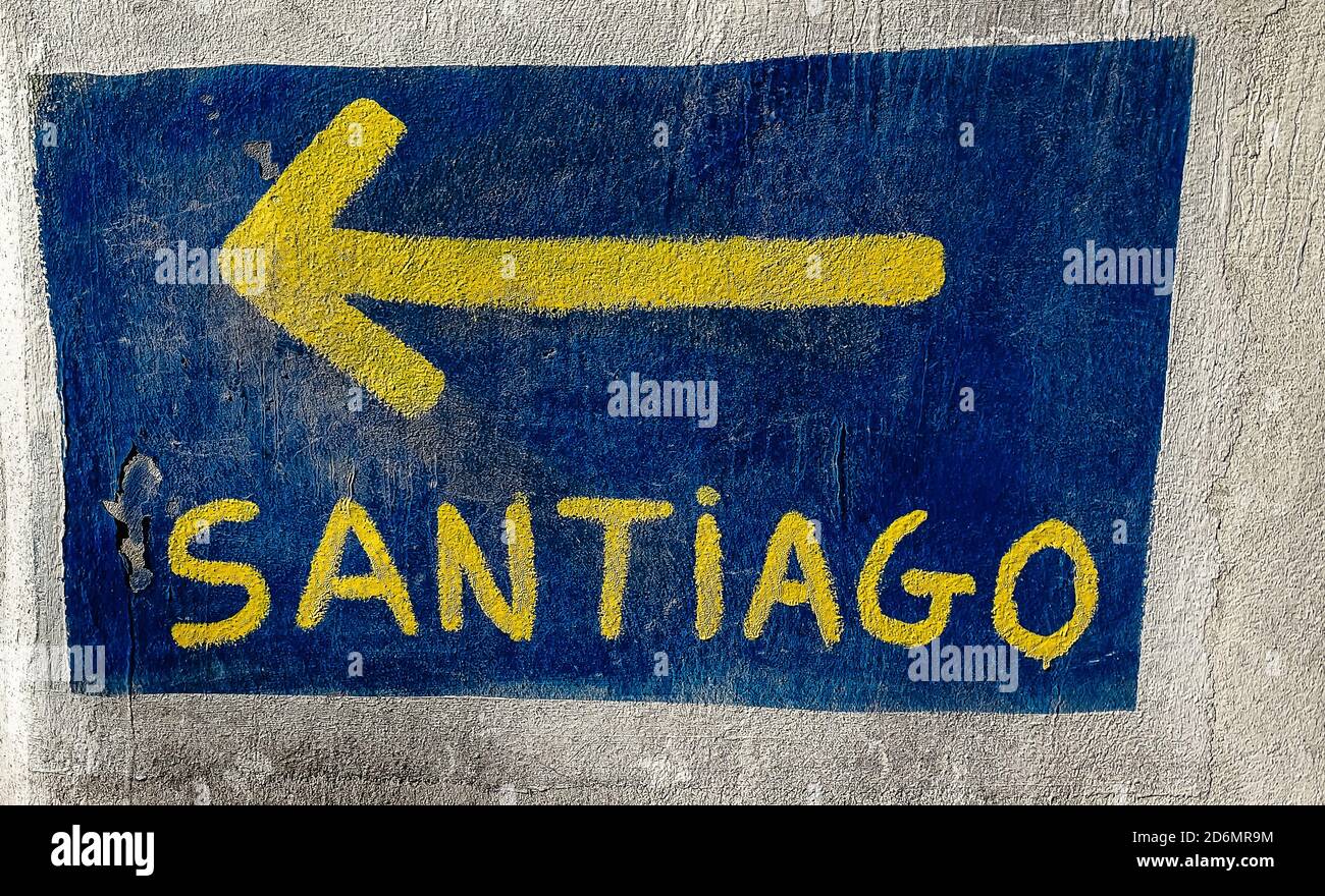 Arrow on a wall indicating to pilgrims the direction to walk in Saint ...