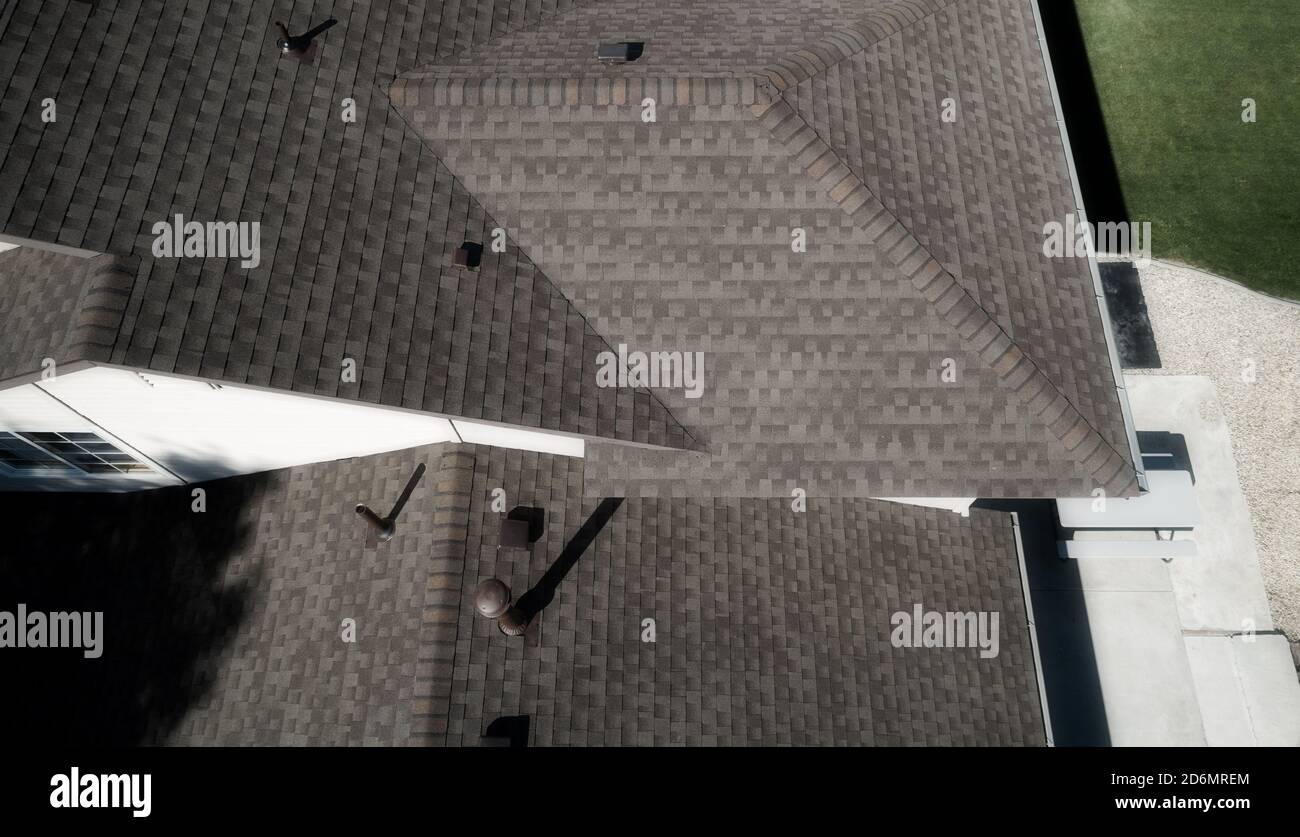 Roof features and shingles on the top of a roof Stock Photo - Alamy