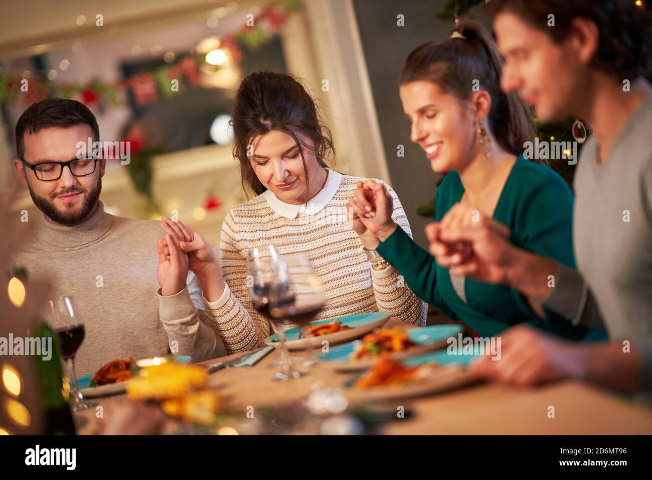 Group people table praying hi-res stock photography and images - Alamy