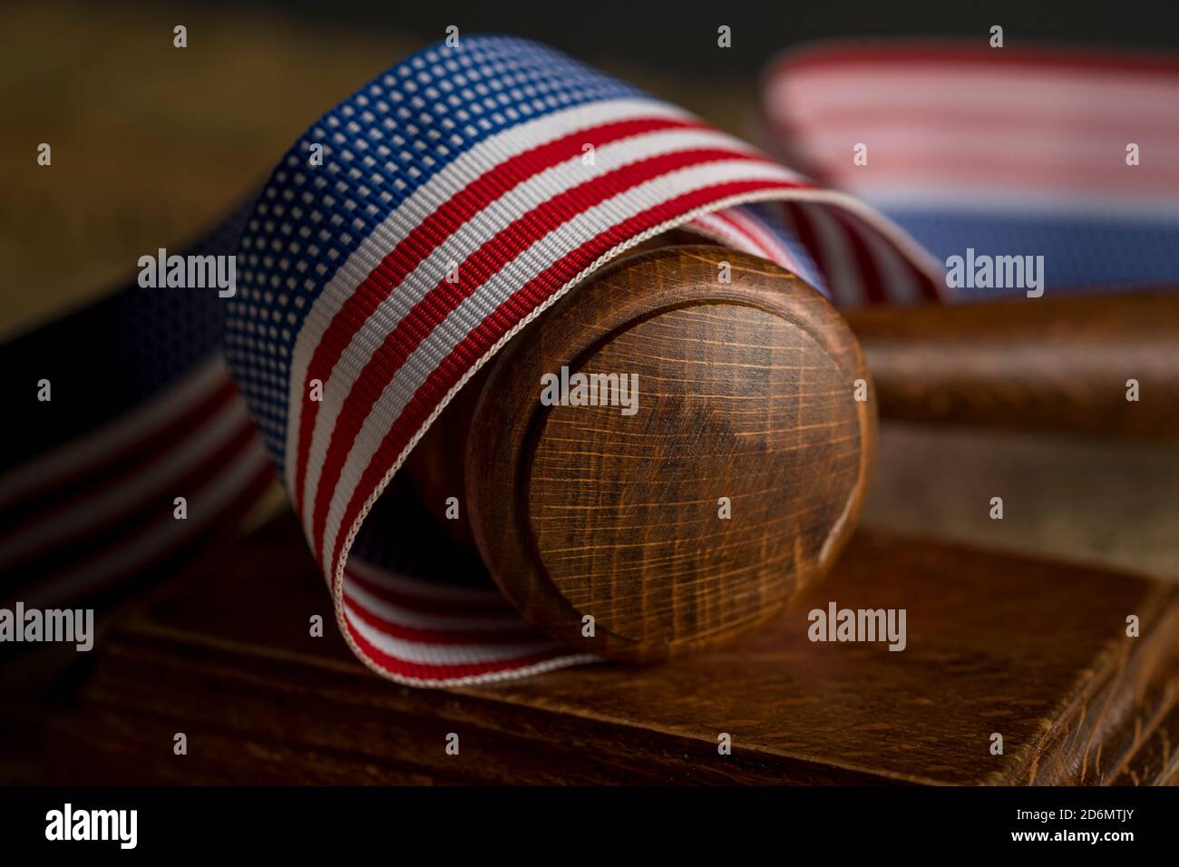 Courtroom gavel with red, white, and blue ribbon Stock Photo - Alamy