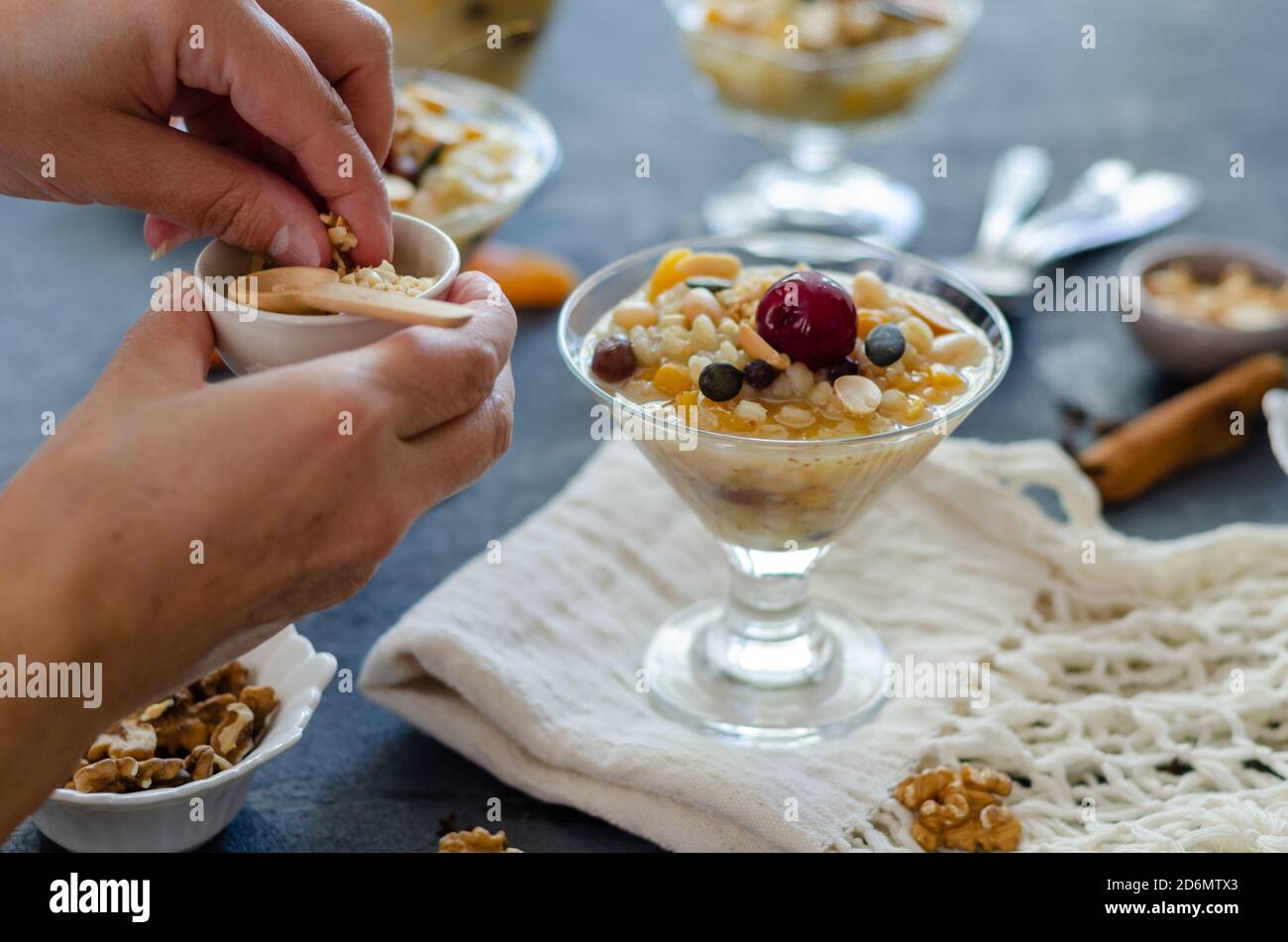 Traditional Turkish dessert Asure or Ashura ( Noah Pudding) making from ...