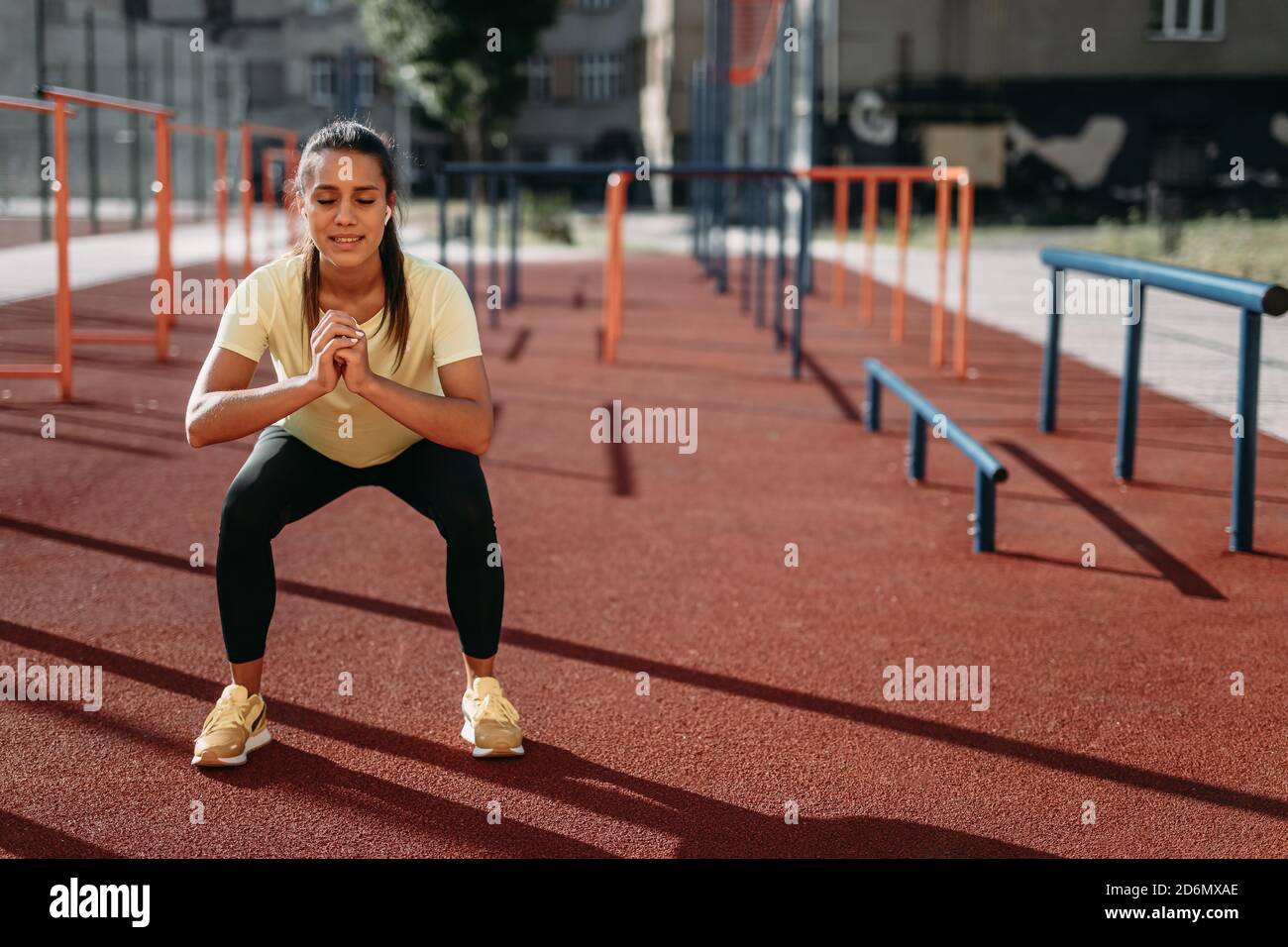 Attractive squatting squat hi-res stock photography and images - Alamy