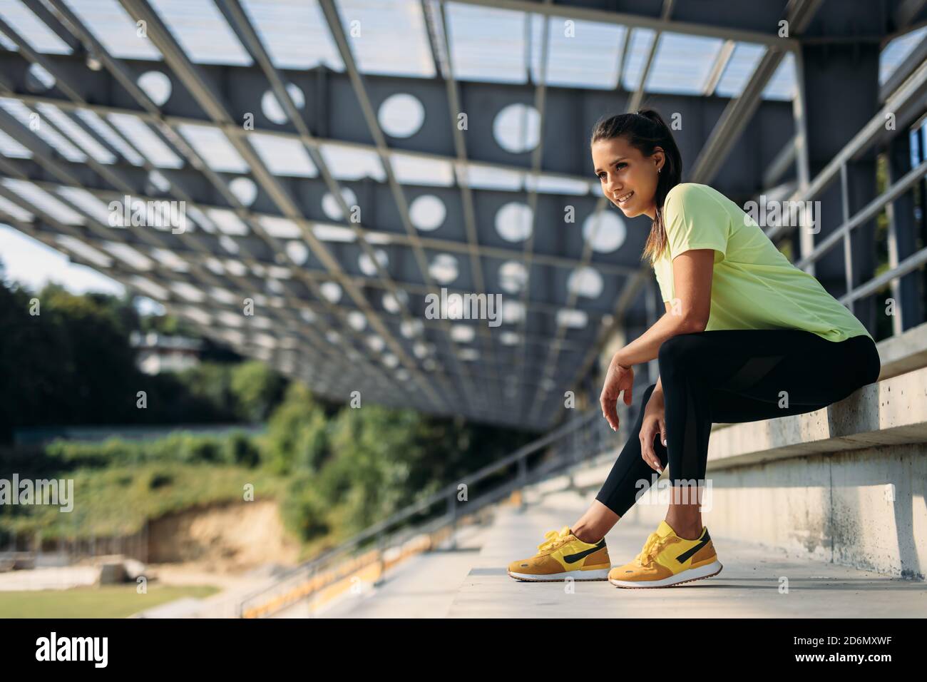 Beautiful woman having rest between exercises outdoors Stock Photo - Alamy