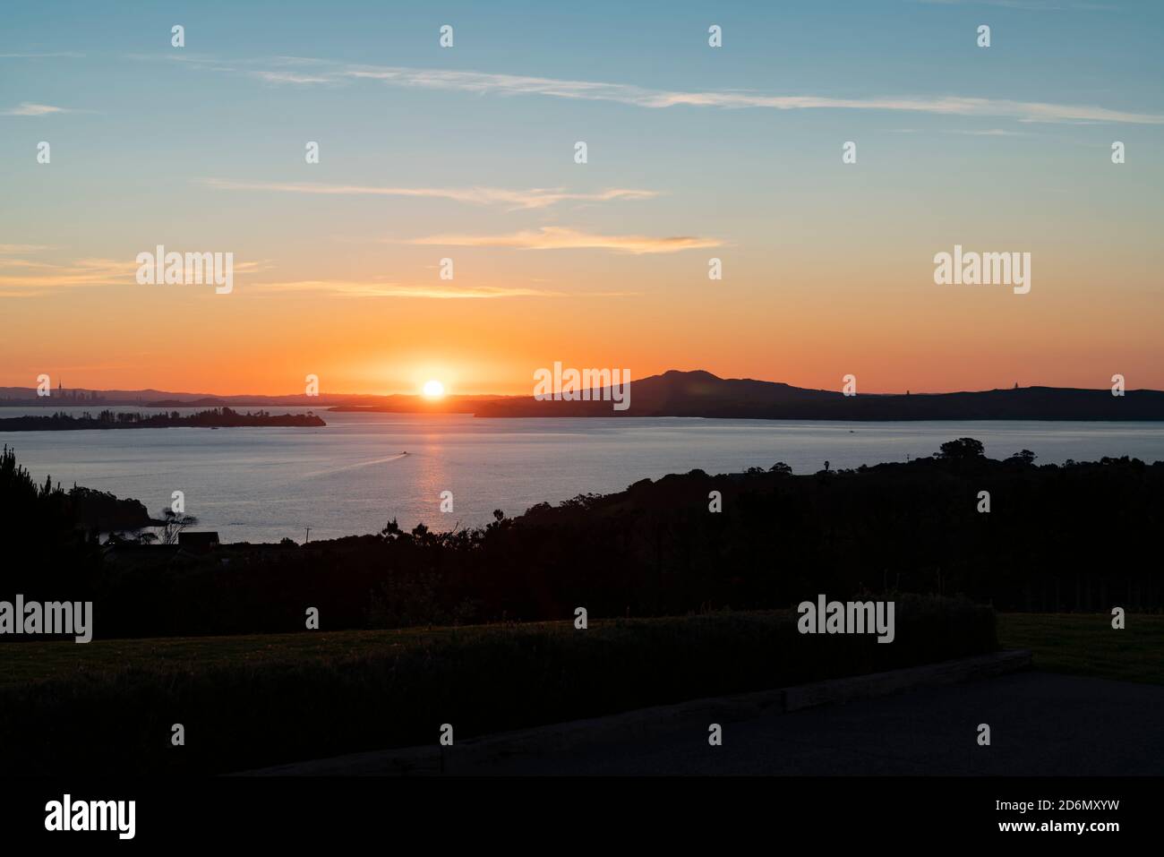 Glorious sunset across Auckland's Waitemata Harbour from Waiheke Island ...