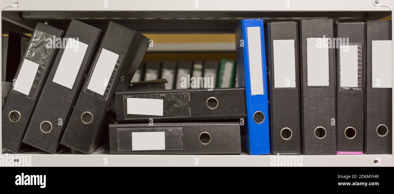 A few of archive folders in the office shelf. papers, documents and ...
