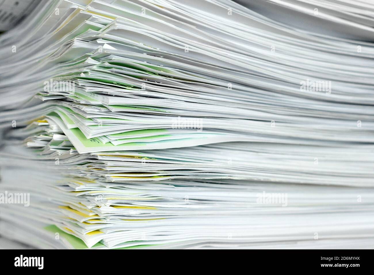 A stack of office papers on a table. Close up view. Selective focus ...